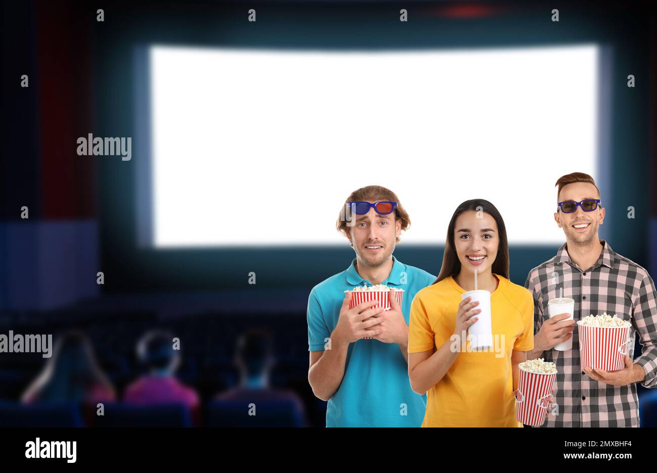 People with 3D glasses, beverage and popcorn in cinema, space for text ...