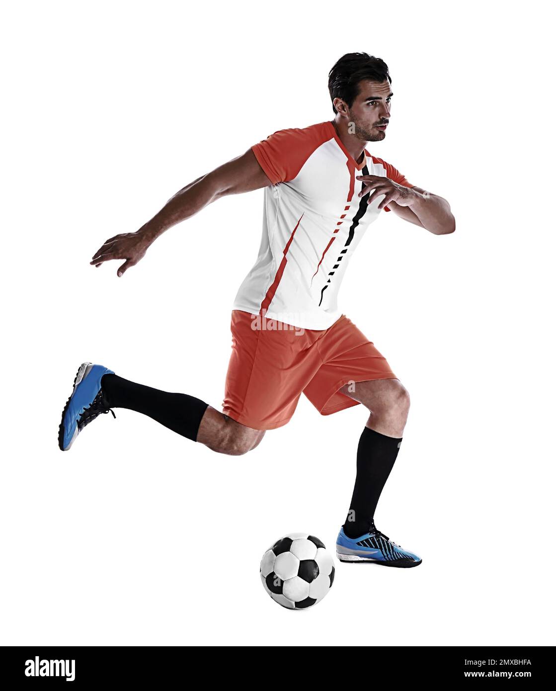 Young man playing football on white background Stock Photo - Alamy