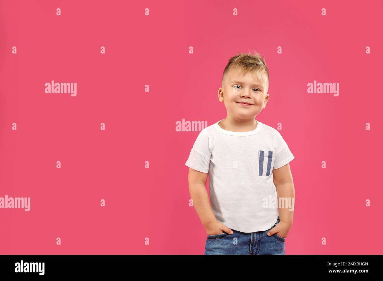 Cute little boy posing on pink background. Space for text Stock Photo ...
