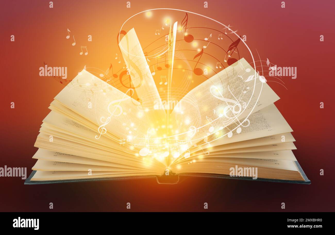 Symphony shining with musical notes from open book on burgundy ...