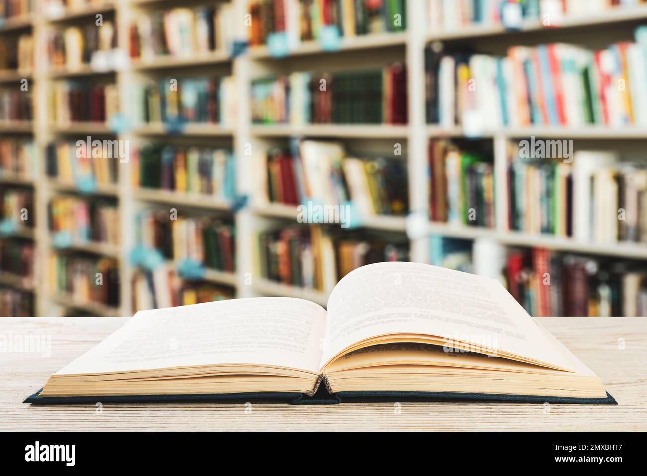 Open book on bookshelves hi-res stock photography and images - Alamy