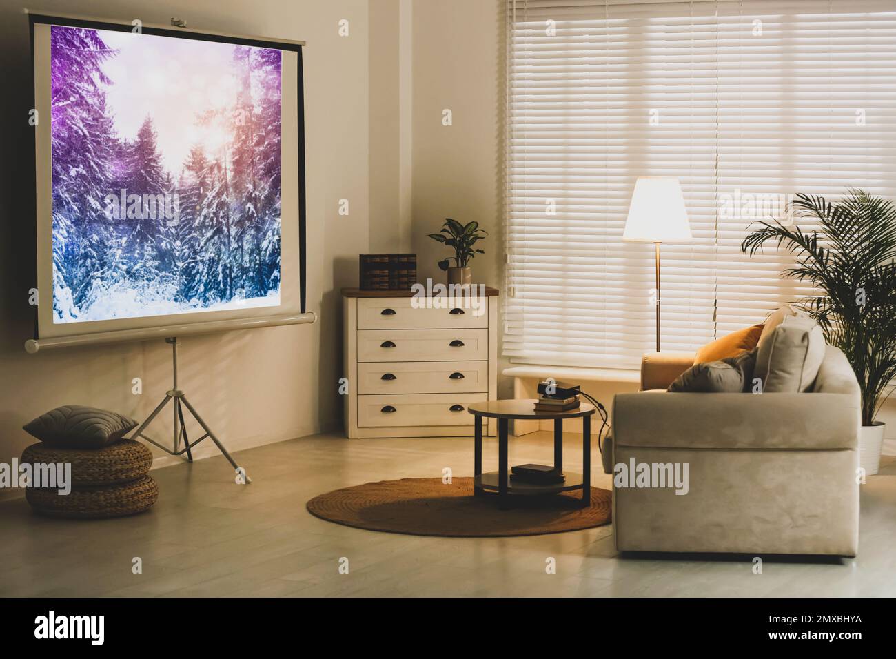 Stylish room with modern video projector and comfortable sofa Stock ...