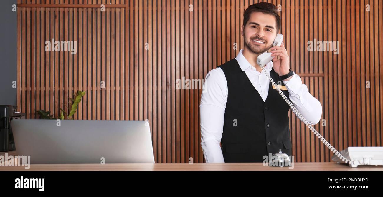 Receptionist talking on phone at desk in lobby. Banner design Stock ...