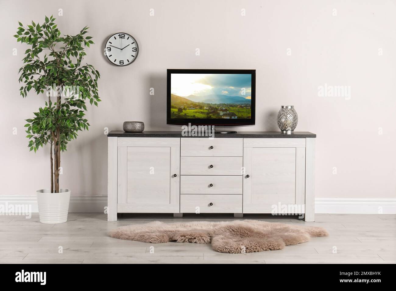 Modern TV set in living room interior Stock Photo - Alamy