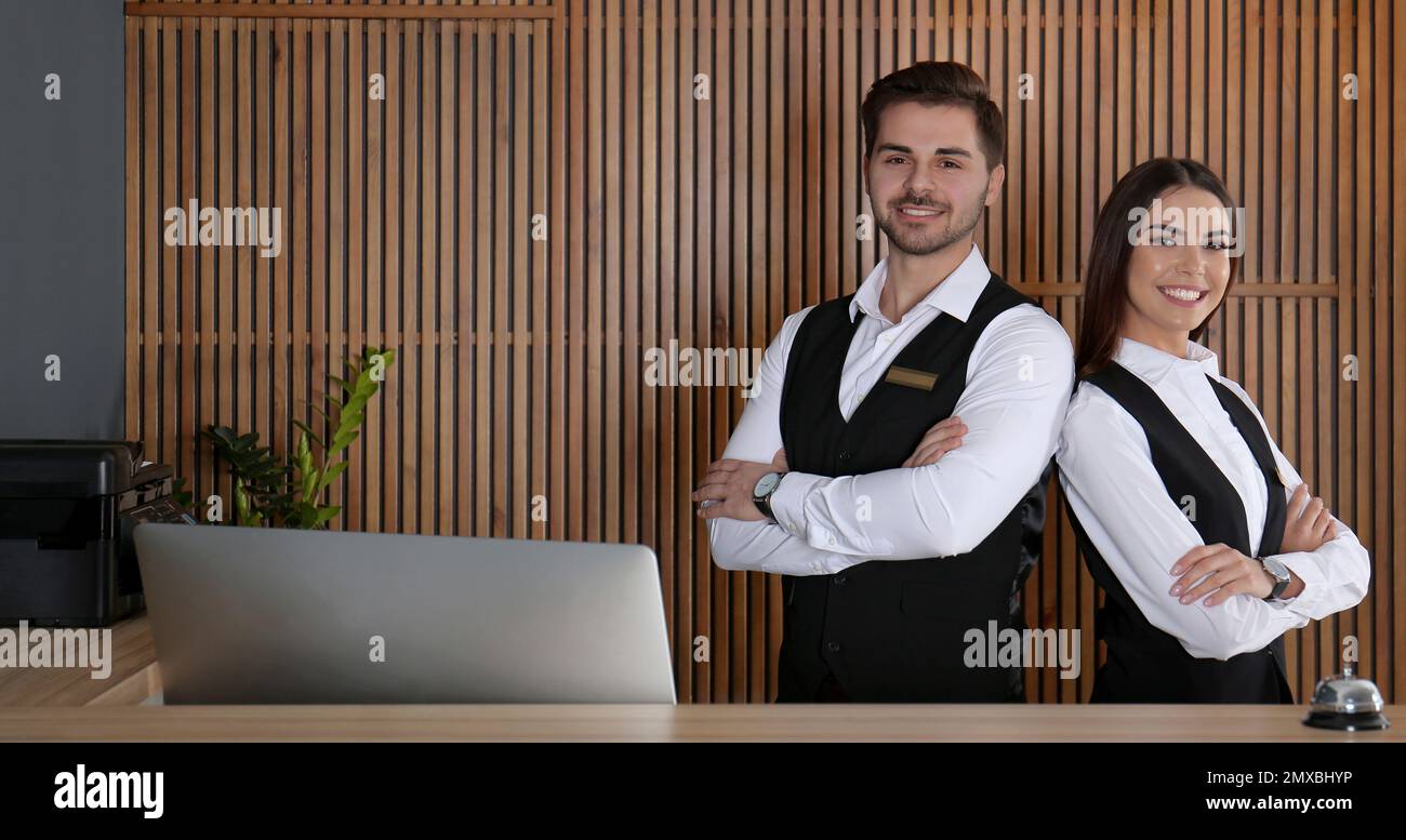 Smiling receptionists at desk in modern lobby. Banner design Stock ...