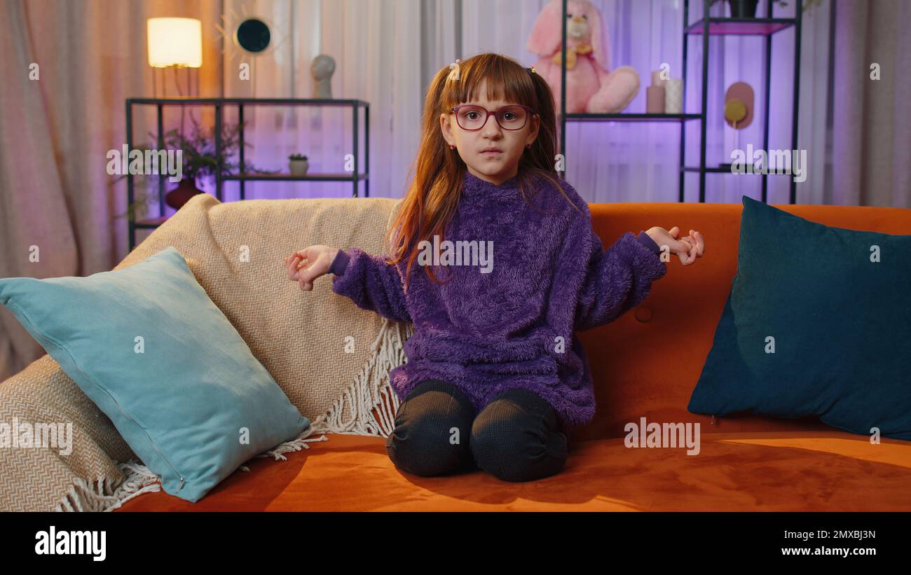 What. Why. Toddler girl raising hands in indignant expression, asking ...