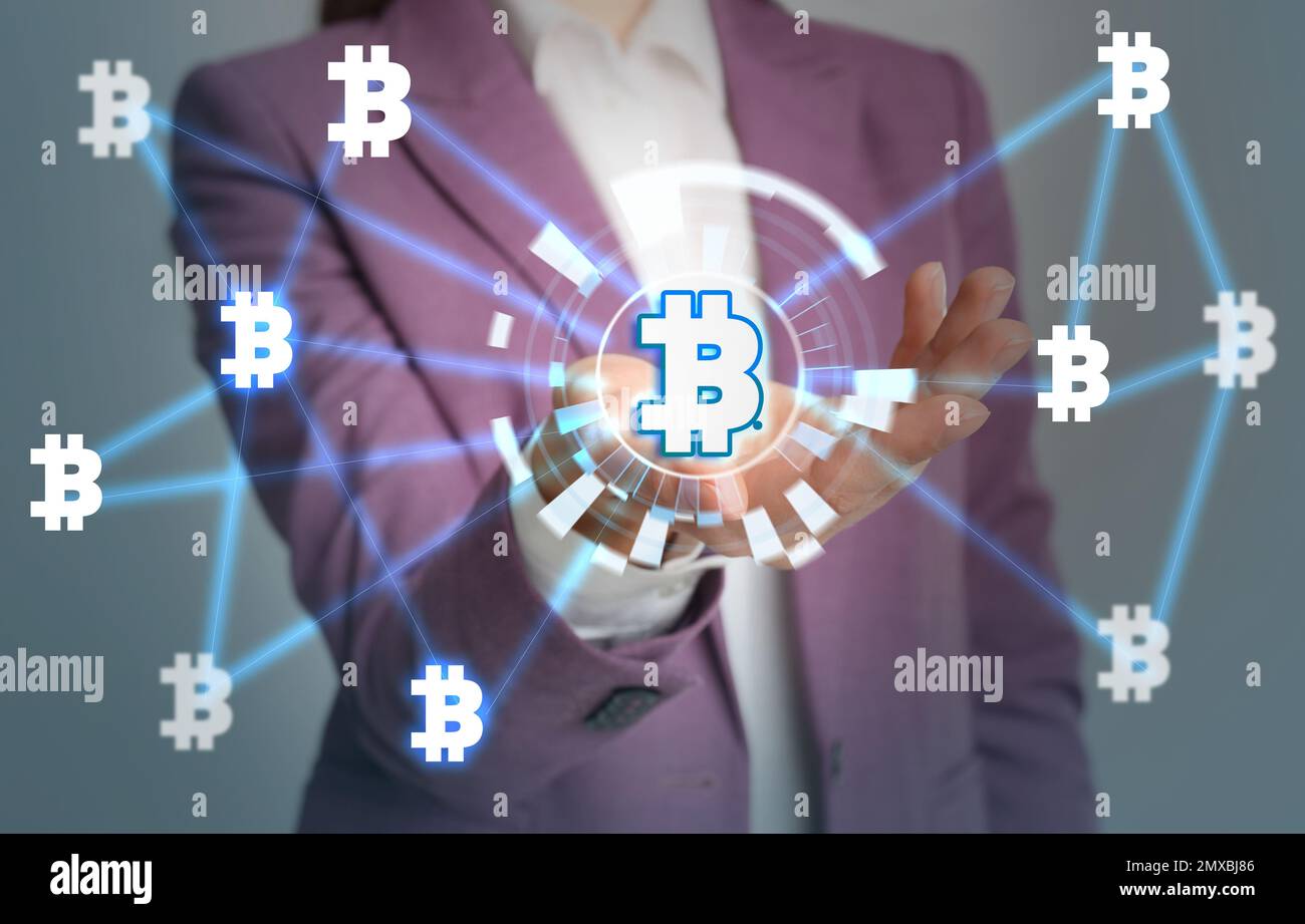 Fintech concept. Woman demonstrating scheme with bitcoin symbols Stock ...