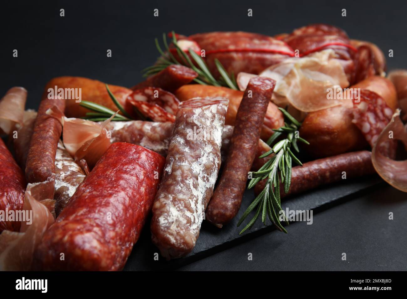 Different types of sausages served on black background, closeup Stock ...