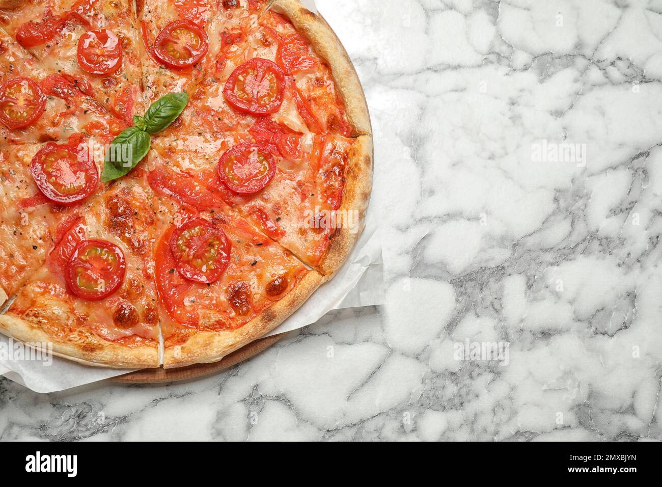 Delicious pizza Margherita on white marble table, top view. Space for ...