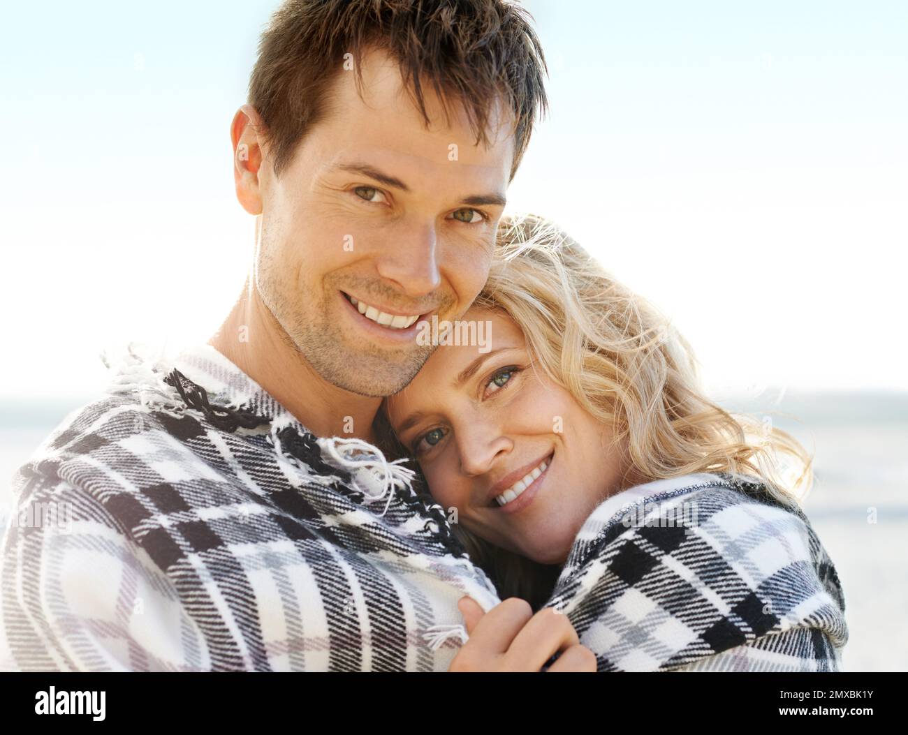 Good to have somebody to lean on. a woman leaning against a man while ...