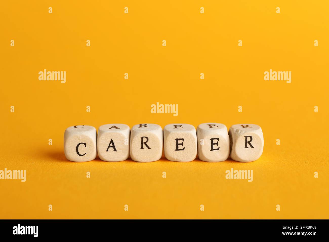 Stone cubes with word CAREER on orange background. Space for text Stock Photo - Alamy