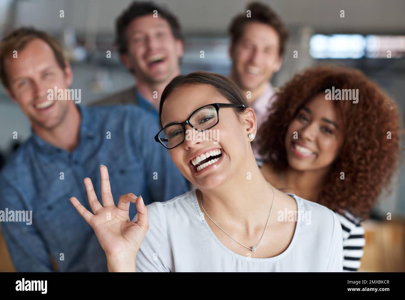 Everything just great. Young woman smiling cheekily at the camera with ...