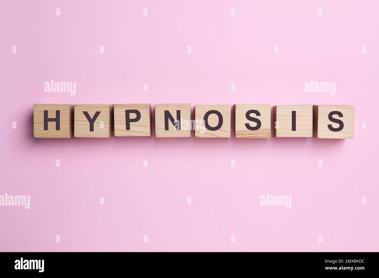 Wooden blocks with word HYPNOSIS on pink background, flat lay Stock ...