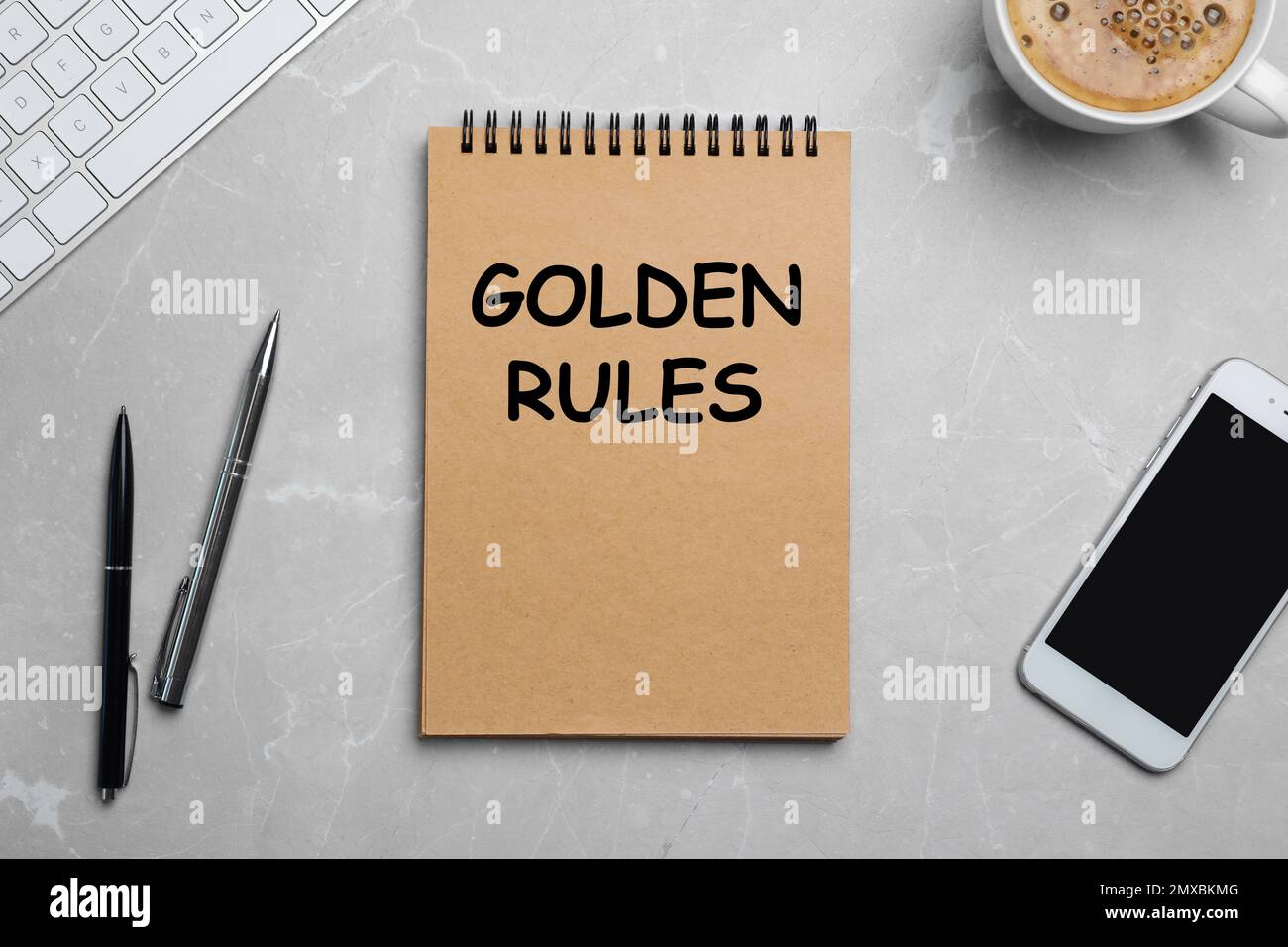 Flat lay composition of notebook with phrase GOLDEN RULES and cup of ...