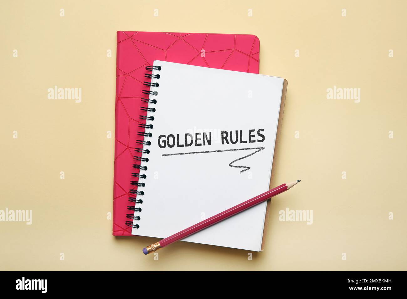 Flat lay composition of notebook with words GOLDEN RULES on beige ...
