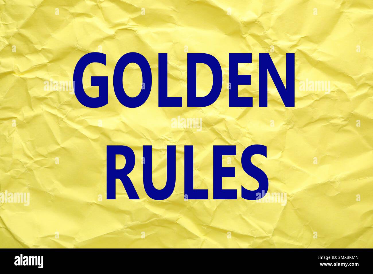 Sheet of color crumpled paper with phrase GOLDEN RULES Stock Photo - Alamy