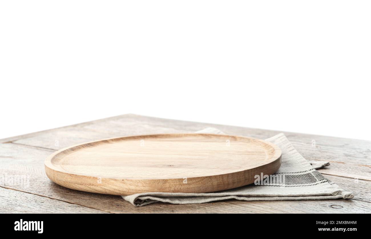 Empty plate and napkin on wooden table against white background Stock ...