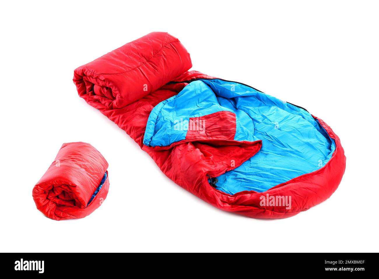 Red sleeping bags on white background. Camping equipment Stock Photo ...