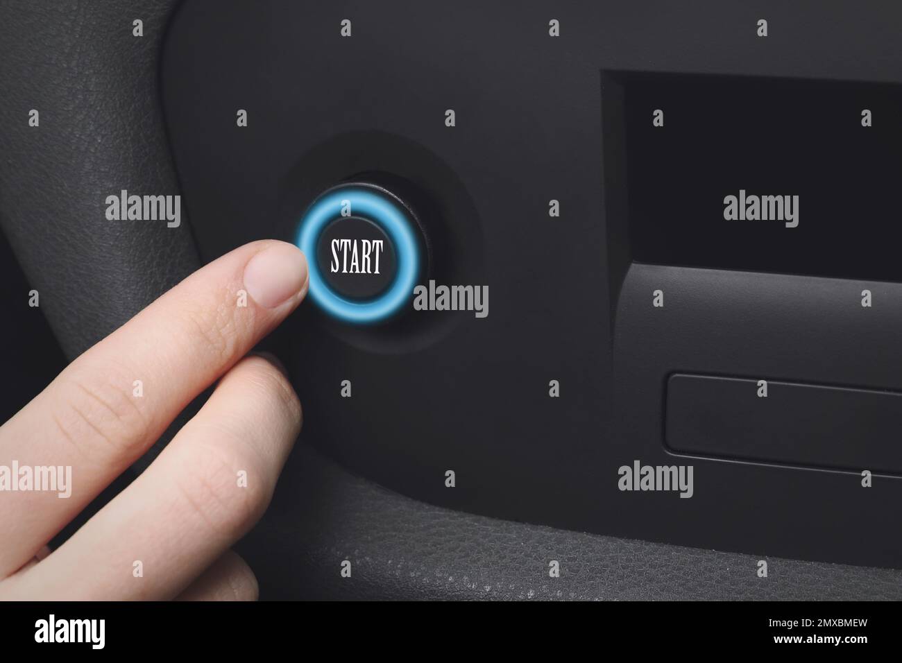 Woman pressing start button in car, closeup Stock Photo - Alamy