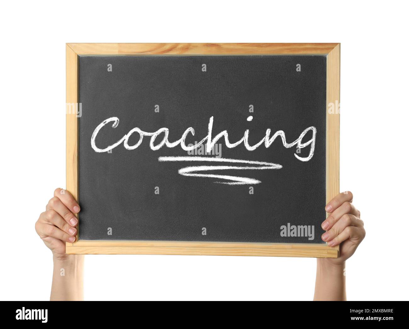 Adult learning. Woman holding blackboard with word Coaching on white ...