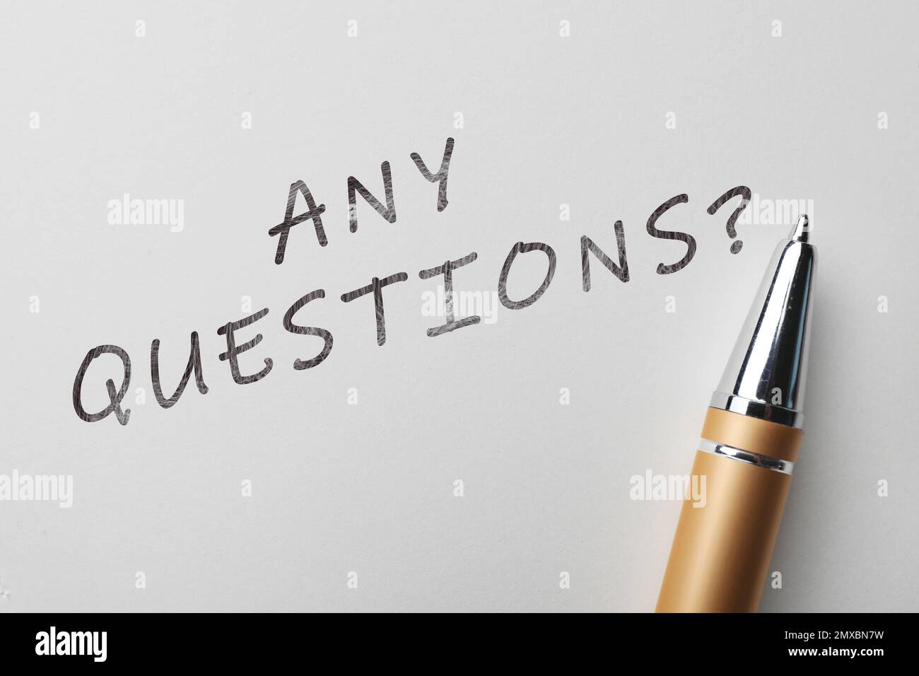 Phrase ANY QUESTIONS and pen on white paper, top view Stock Photo - Alamy