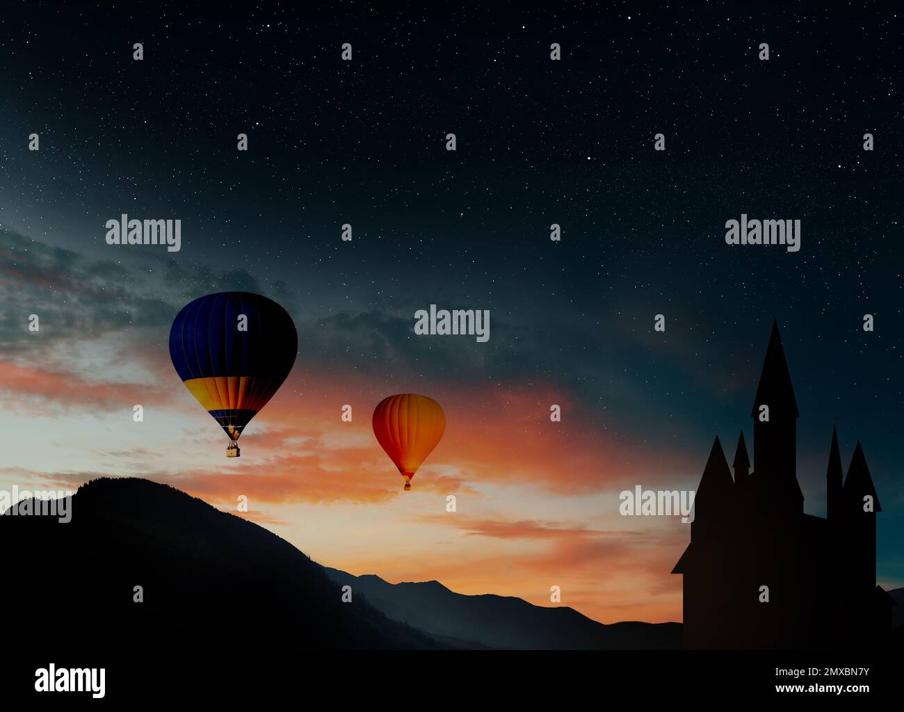 Fairy tale world. Hot air balloons flying near hideaway castle in ...