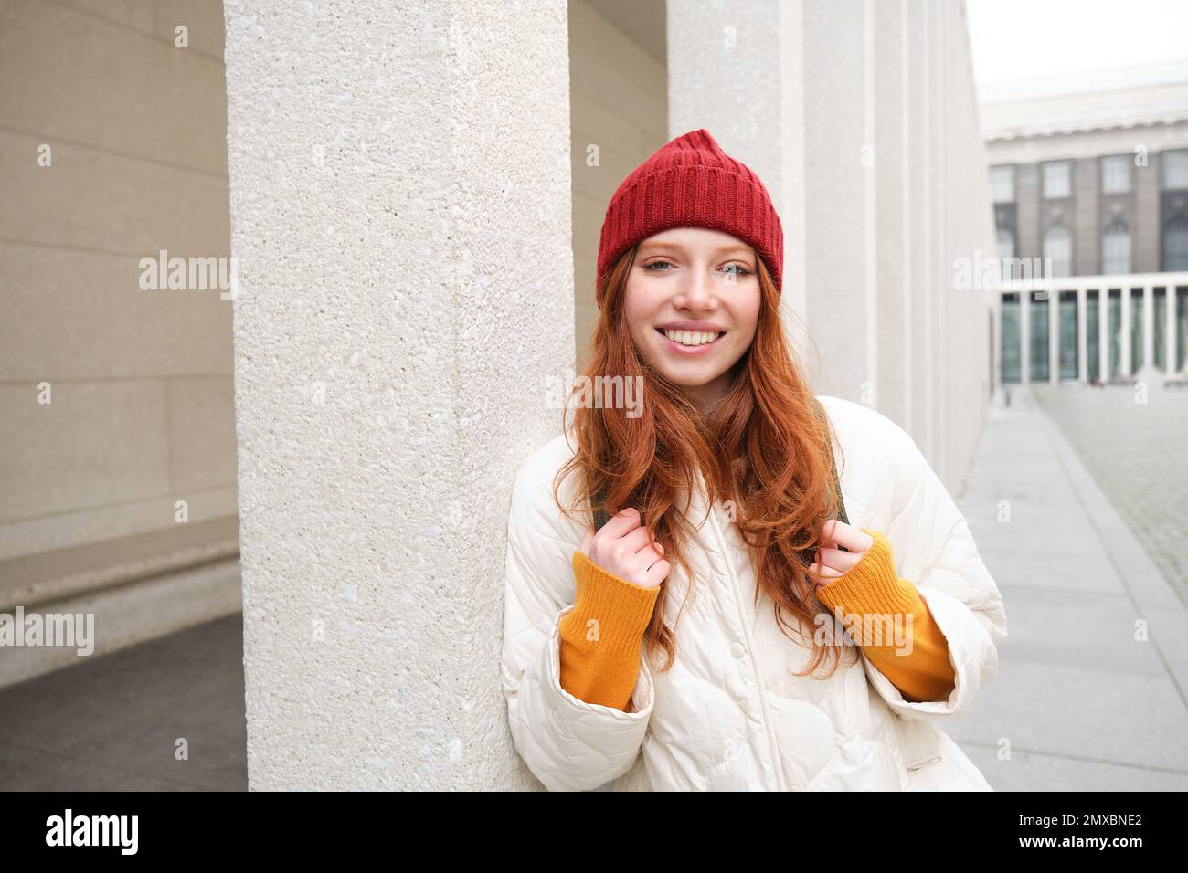 Happy redhead girl, tourist going around town, exploring sighsteeing ...
