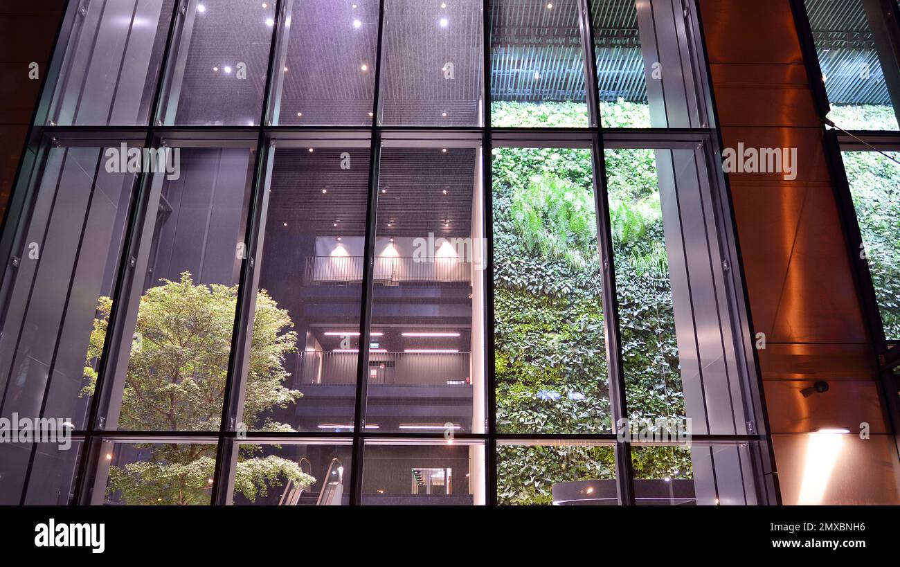 Night architecture, skyscraper with glass facade. Modern building in ...