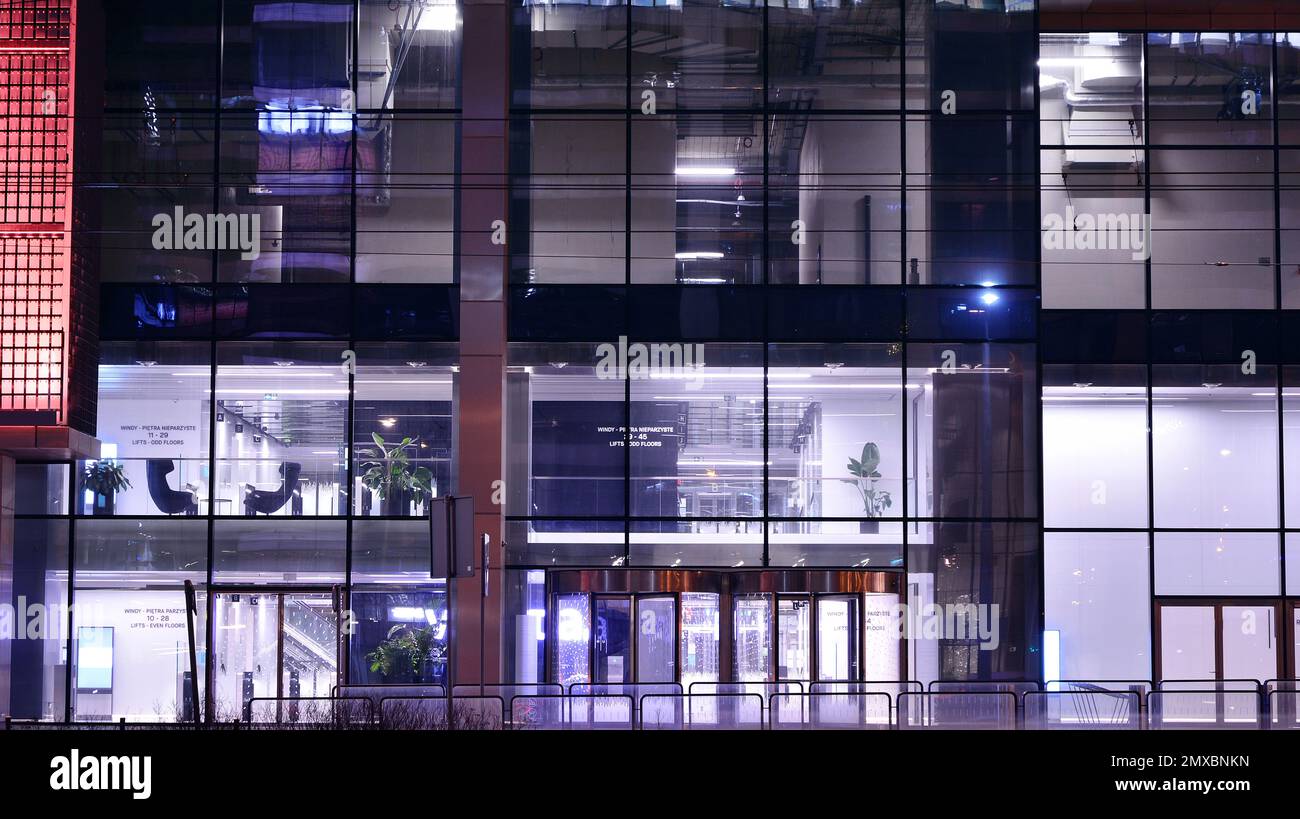 Night architecture, skyscraper with glass facade. Modern building in ...