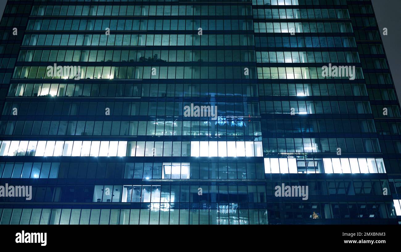 Amazing night cityscape. Office building at night, building facade with ...
