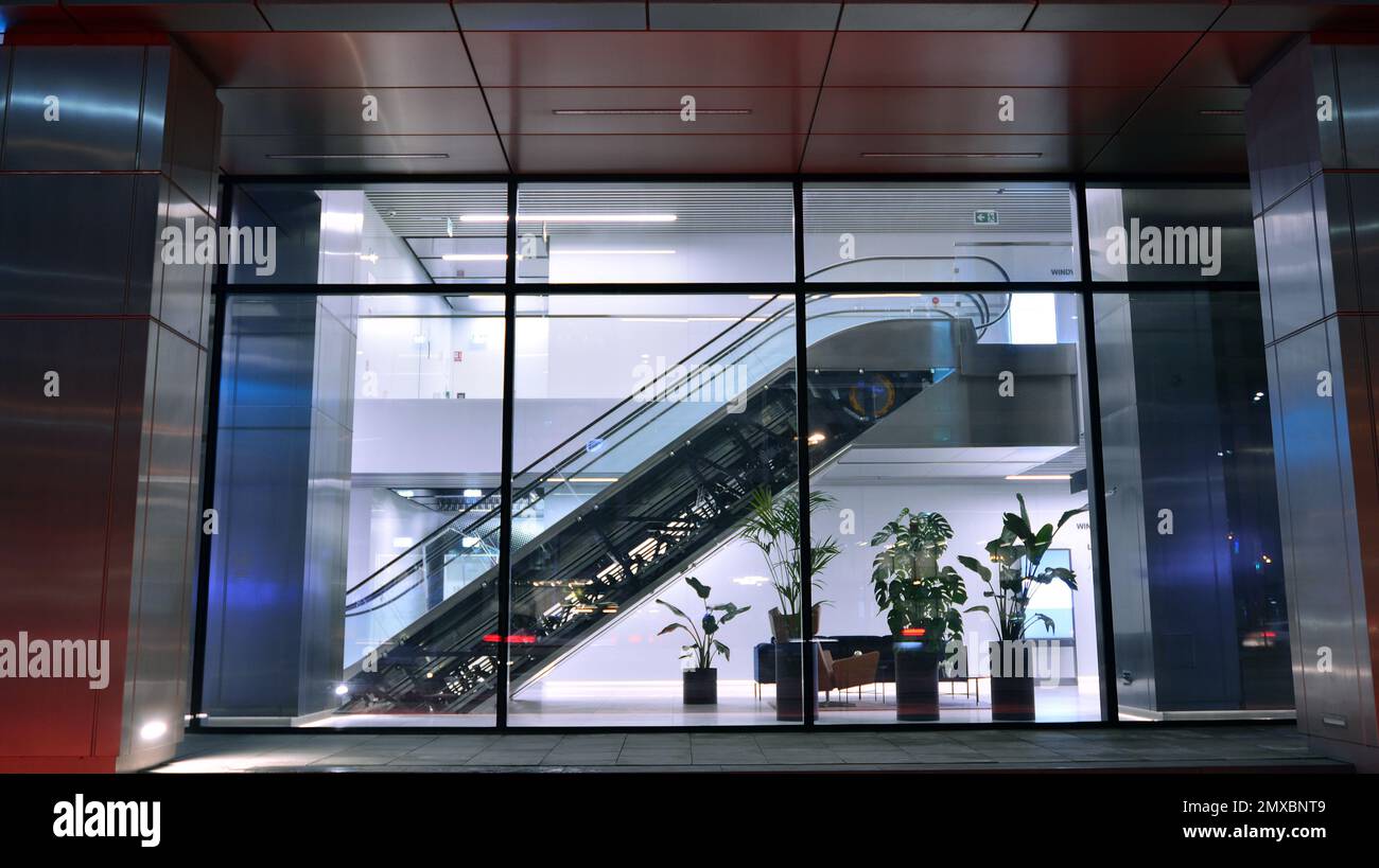 Night architecture, skyscraper with glass facade. Modern building in ...