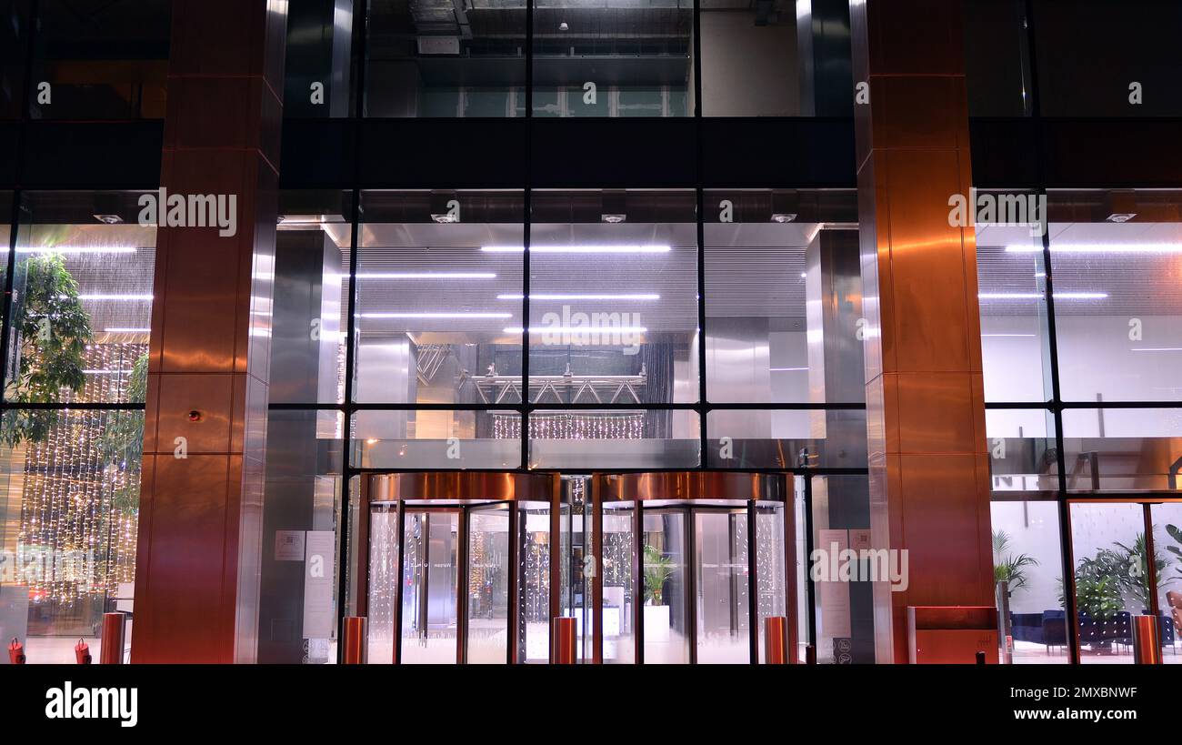 Night architecture, skyscraper with glass facade. Modern building in ...