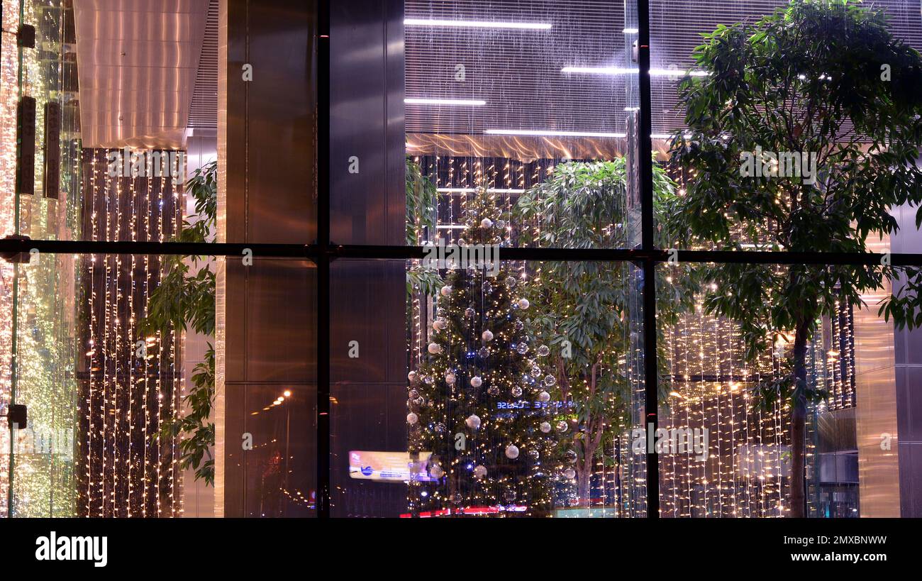 Night architecture, skyscraper with glass facade. Modern building in ...