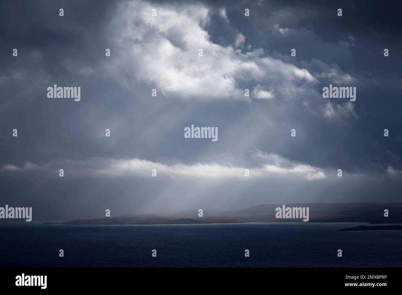 Cloudscape, nightfall in the Lapland mountains. Lake on this side and ...