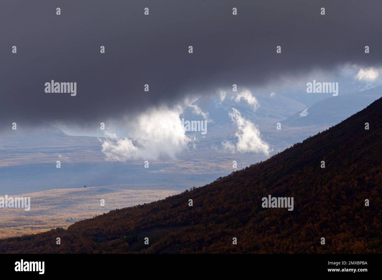 Cloudscape, nightfall in the Lapland mountains. Dramatic weather ...