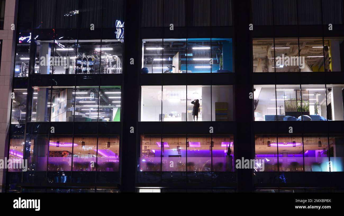 Amazing night cityscape. Office building at night, building facade with ...