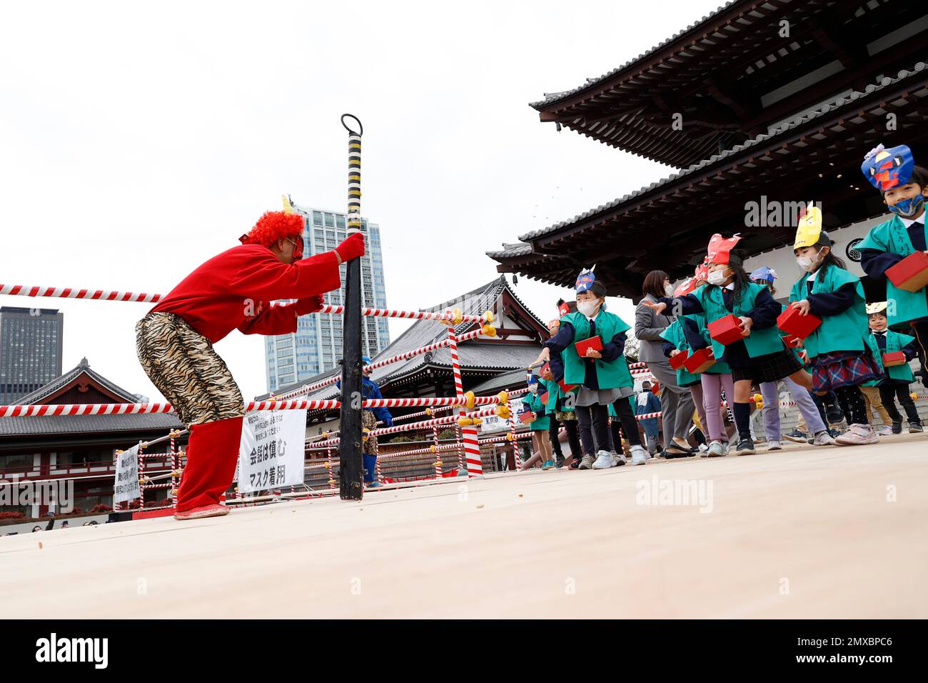 Tokyo, Japan. 3rd Feb, 2023. Children throw soybeans bags to a Japanese ...