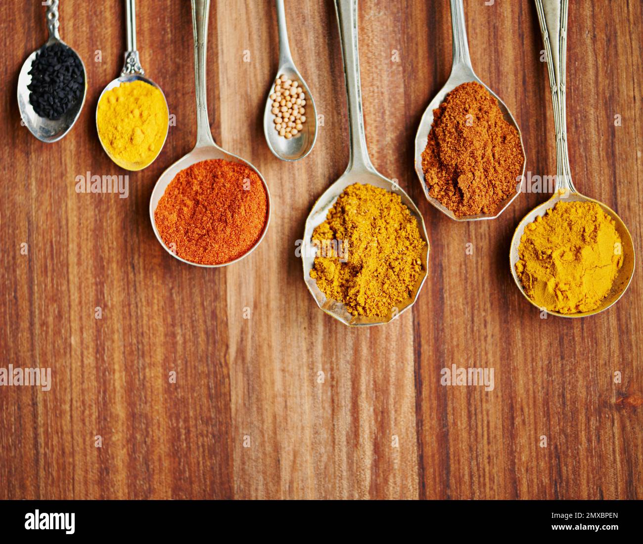 Curry combinations. spoons filled with a variety of spices Stock Photo ...