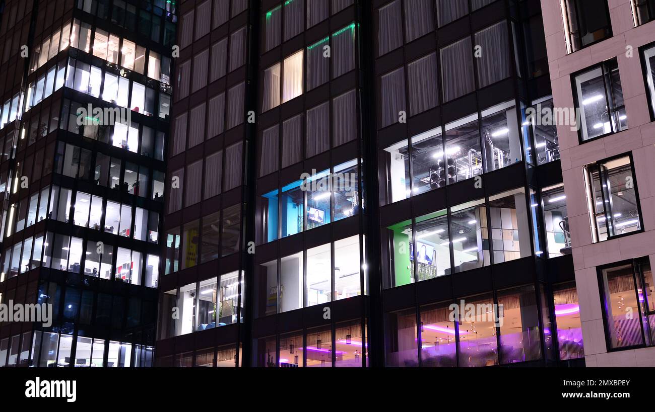 Amazing night cityscape. Office building at night, building facade with ...