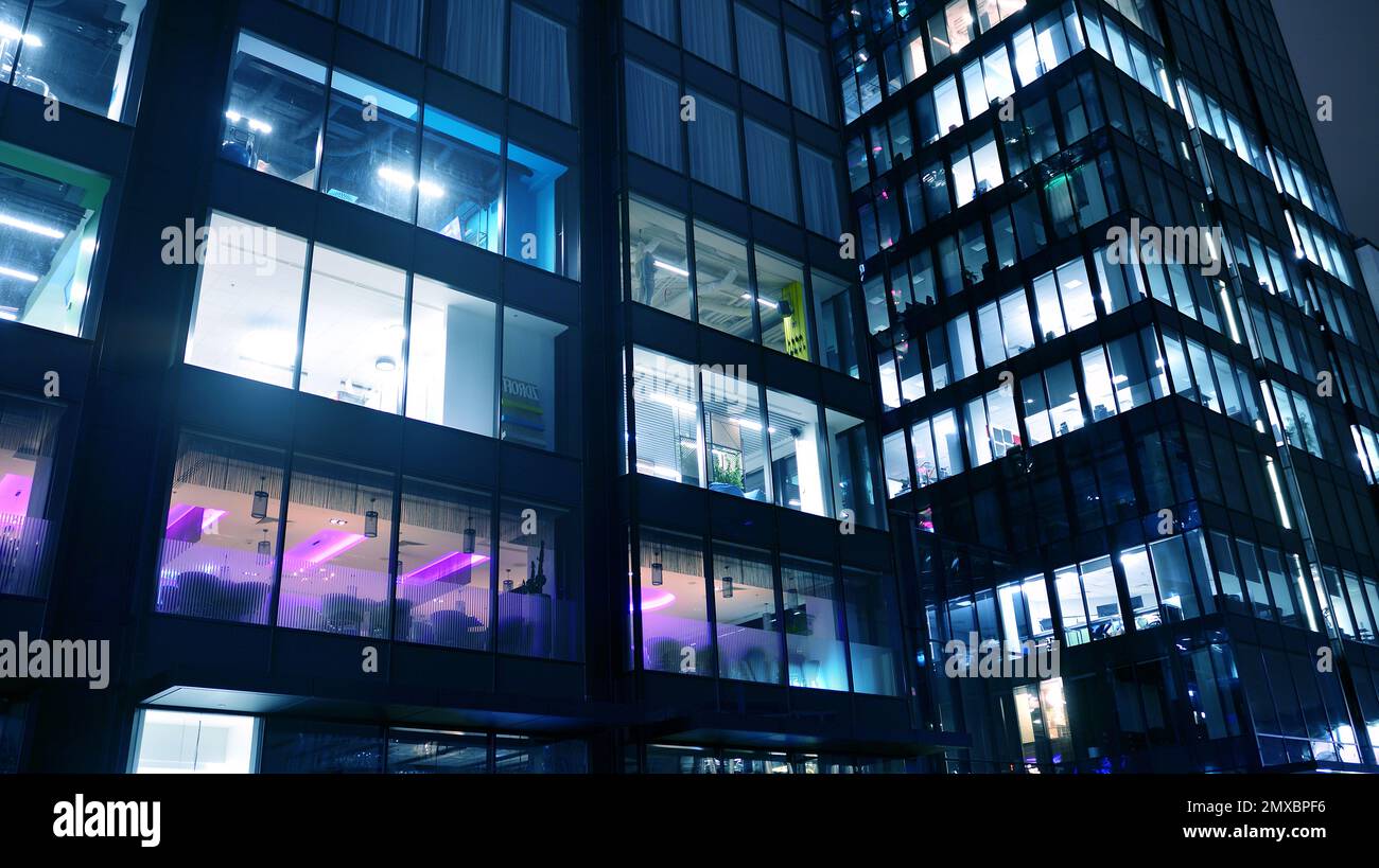 Amazing night cityscape. Office building at night, building facade with ...