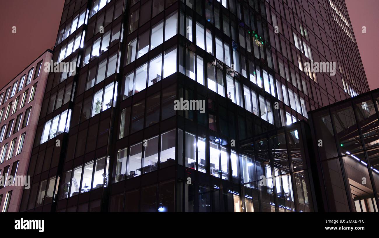 Amazing night cityscape. Office building at night, building facade with ...