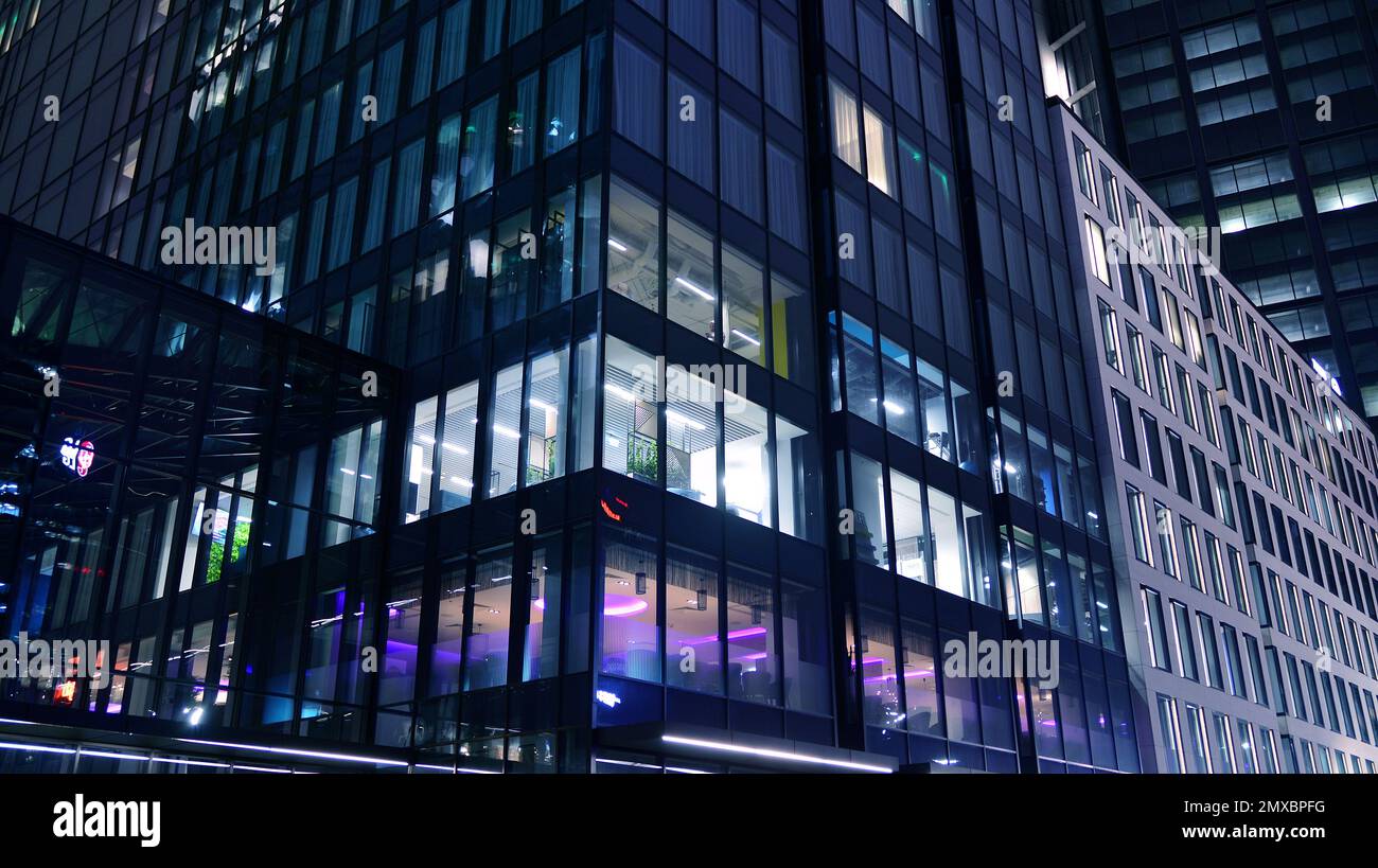 Amazing night cityscape. Office building at night, building facade with ...