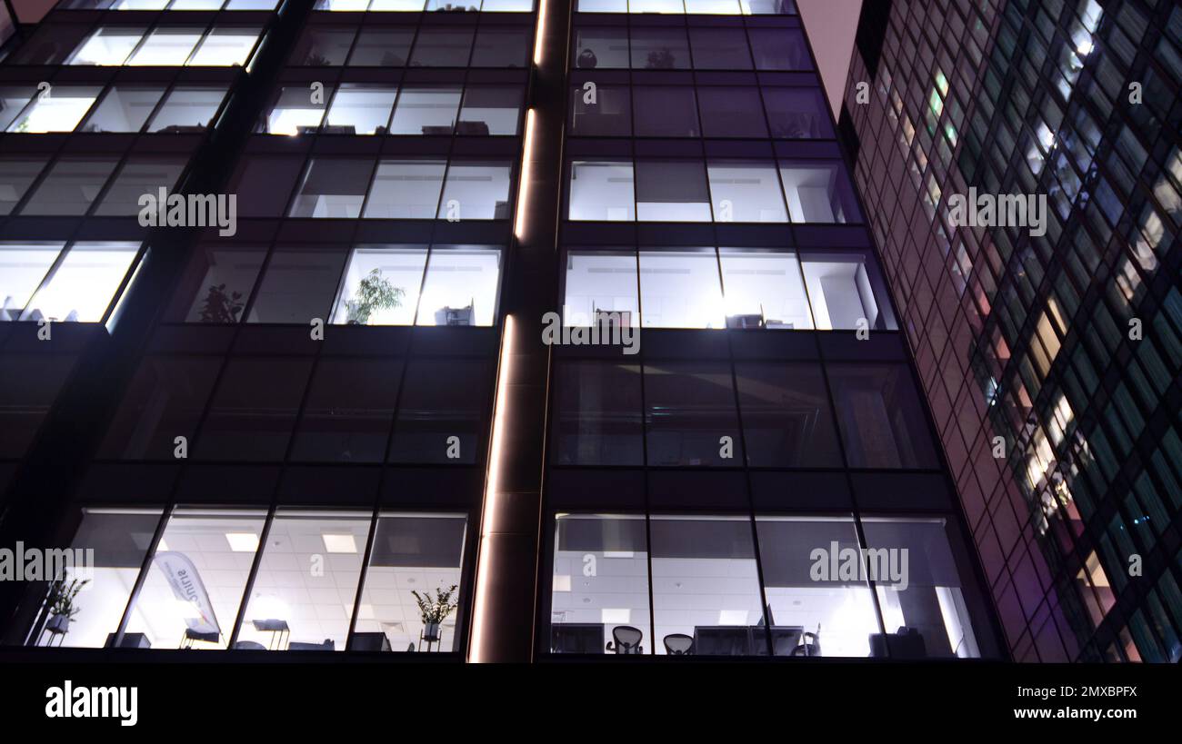 Amazing night cityscape. Office building at night, building facade with ...