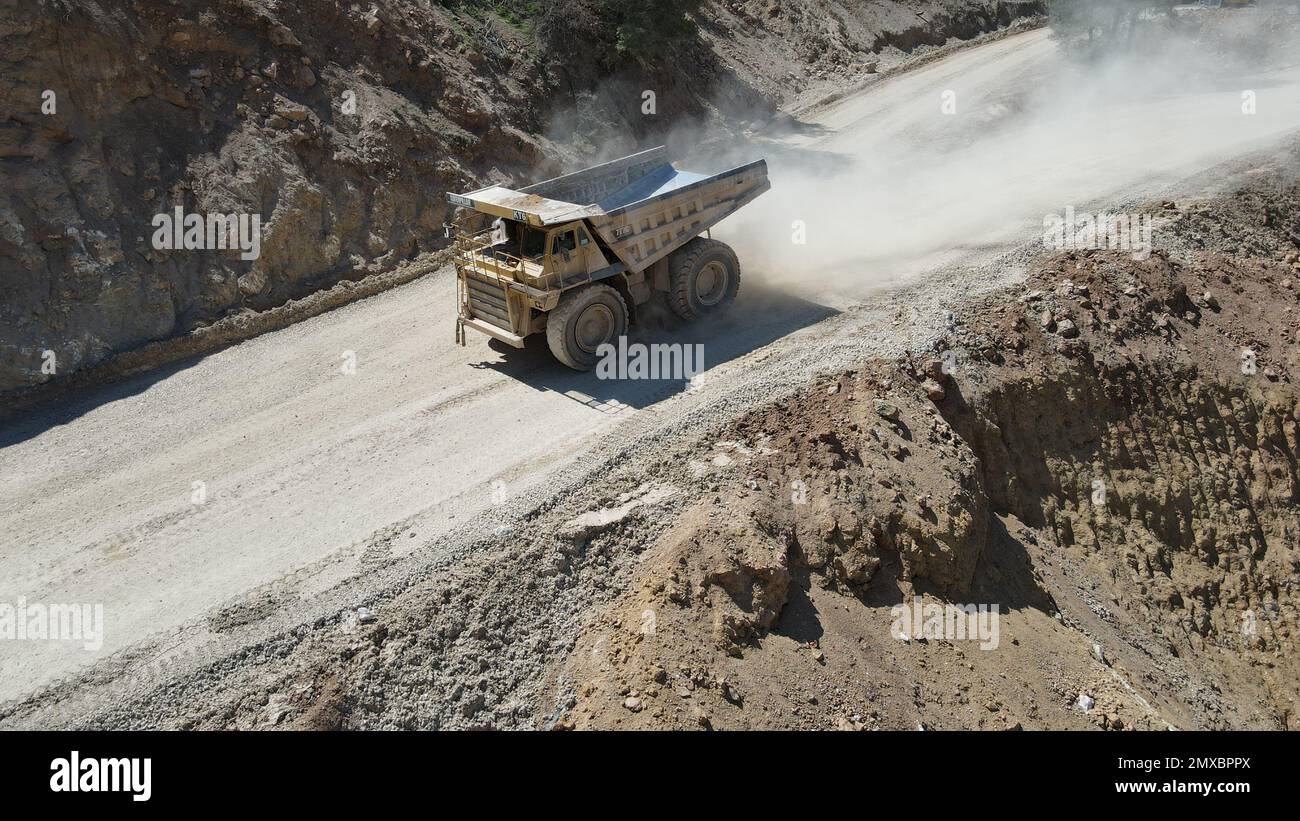 Large quarry dump truck full of stones. Transporting the ore into the ...