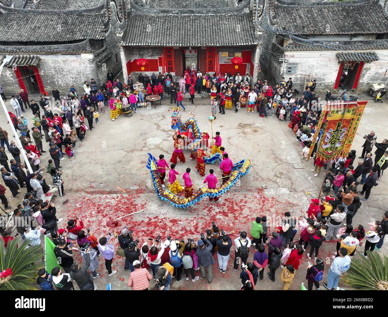 Villagers perform traditional dragon dance to celebrate the Lantern Festival in Wentang Village ...