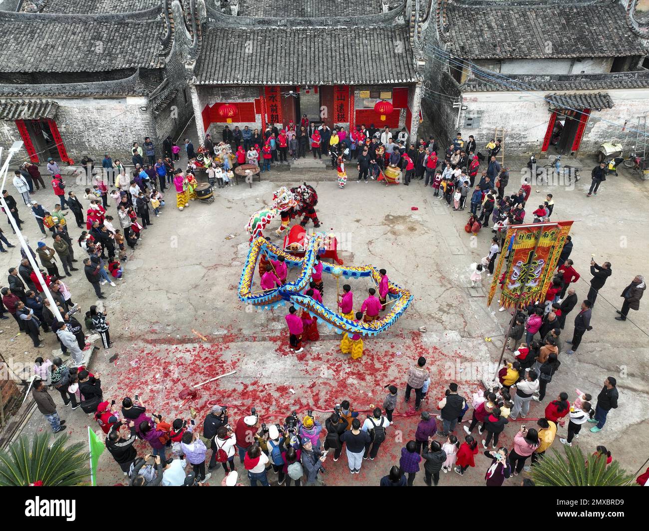 Villagers perform traditional dragon dance to celebrate the Lantern Festival in Wentang Village ...