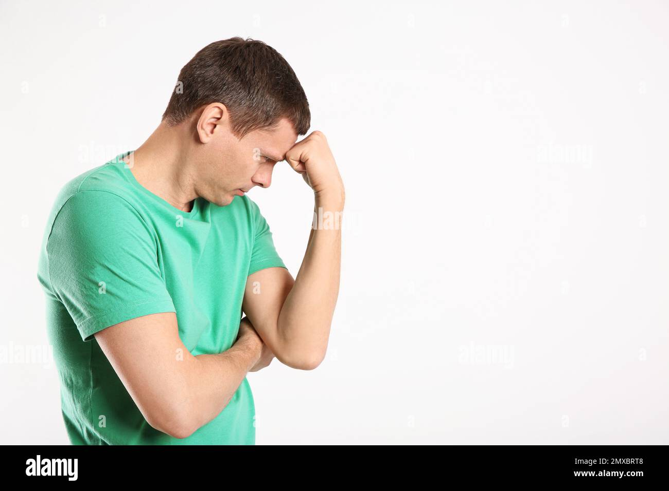 Emotional man in casual outfit on white background Stock Photo - Alamy