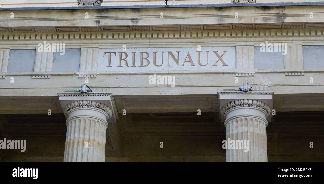 tribunaux text on ancient facade door entrance building means in french ...