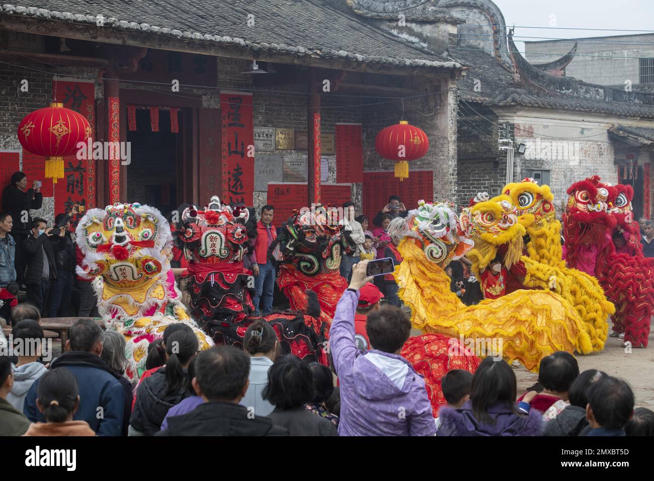 Villagers perform traditional dragon dance to celebrate the Lantern Festival in Wentang Village ...