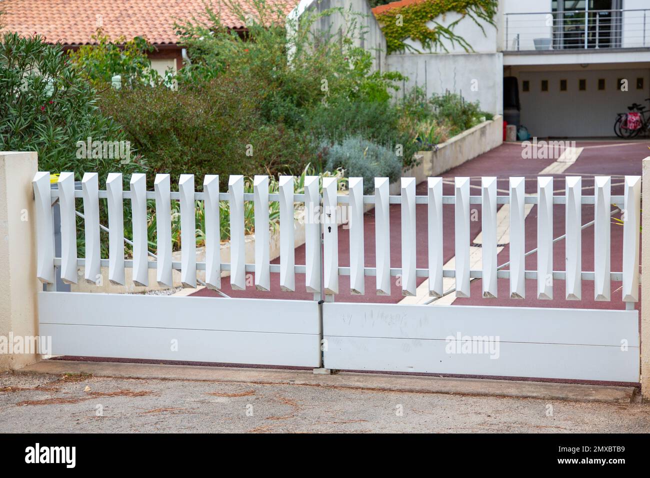 PVC gate of design modern house white home door slats Stock Photo - Alamy